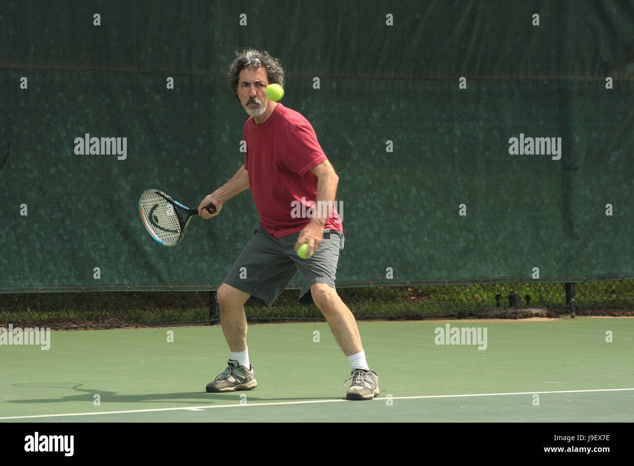 Man playing tennis Stock Photo - Alamy