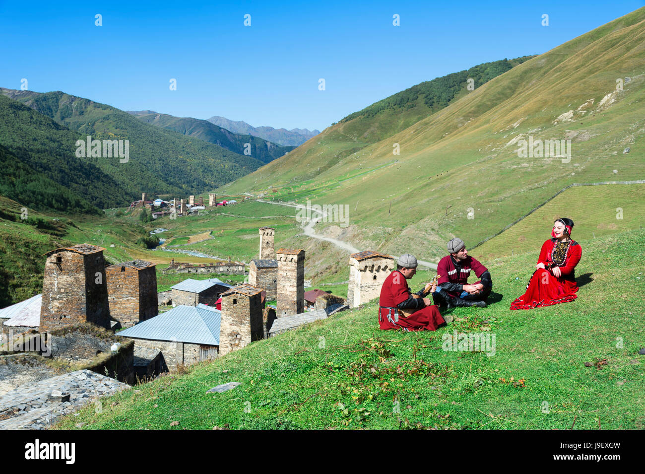 Georgian people of a folkloric group playing Panduri and dancing in ...