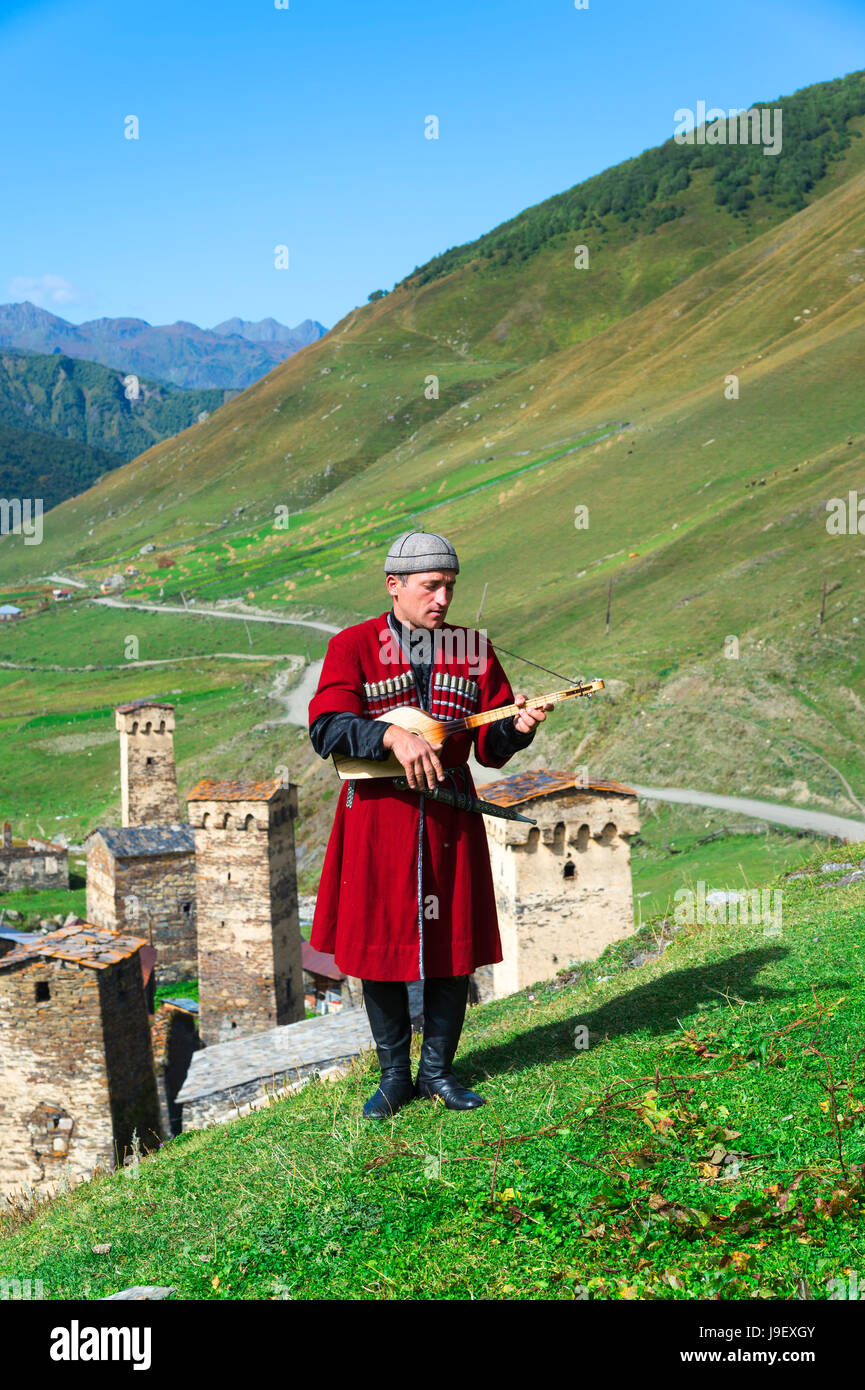 Georgian musician of a folkloric group playing Panduri, For editorial ...