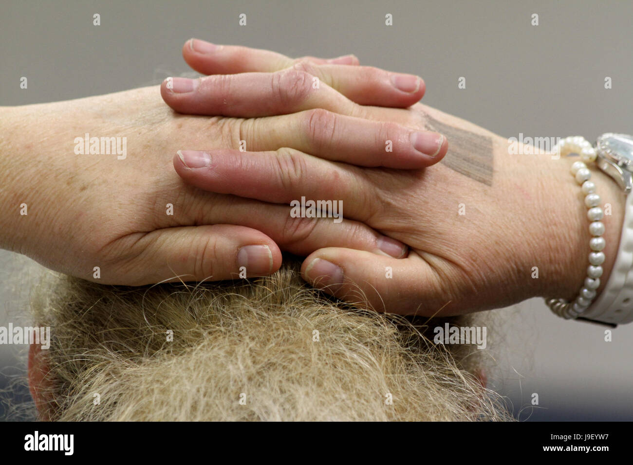 Close up of woman's hands on her hand, in a tense posture Stock Photo ...