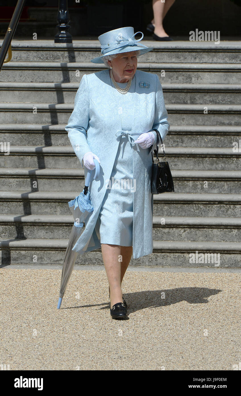 Queen Elizabeth II arrives for a garden party at Buckingham Palace in ...