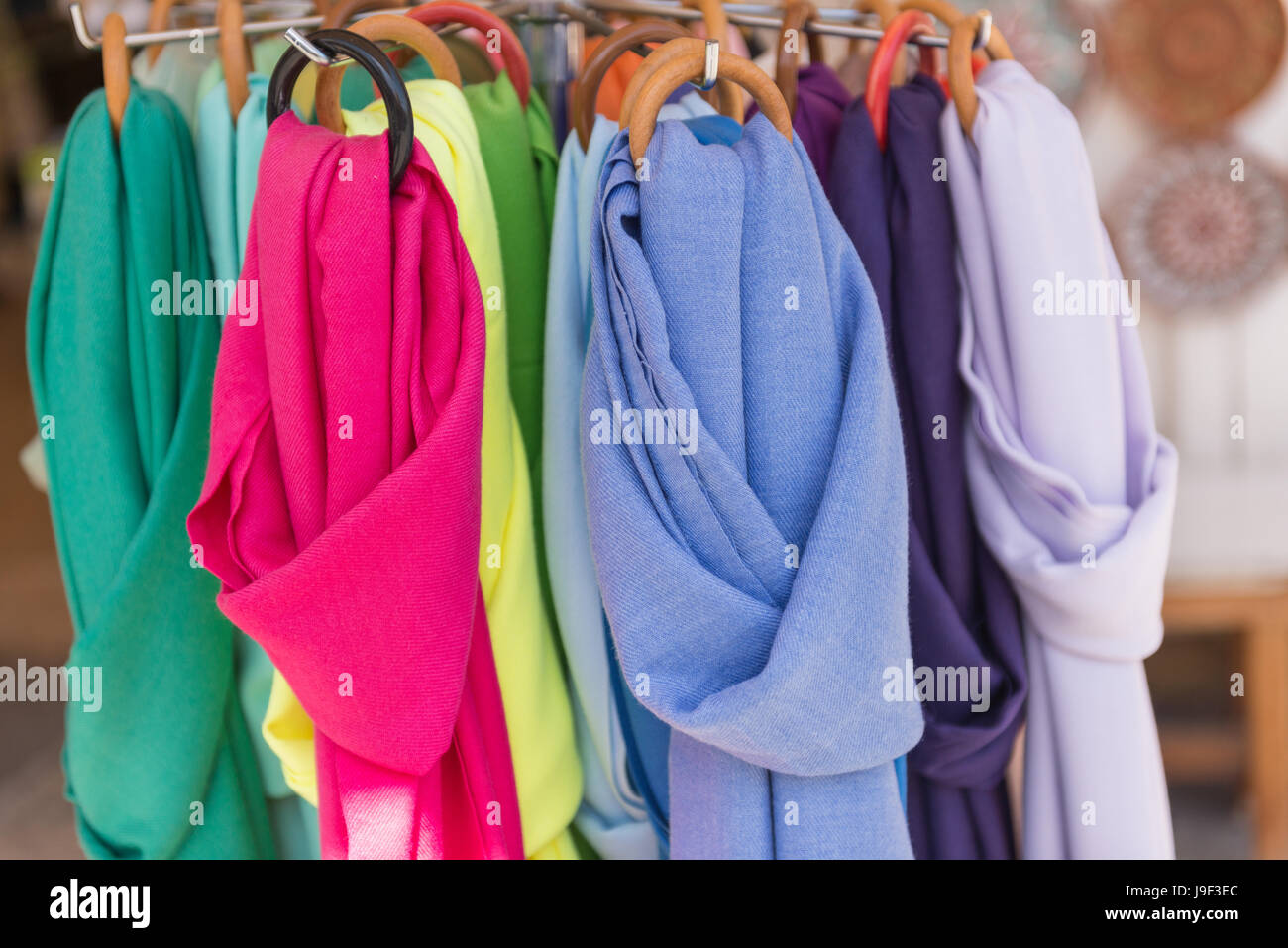 Colourful wool scarves on display at market Stock Photo - Alamy