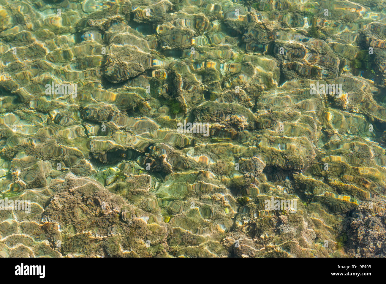 Reflections and patterns of water ripples at sea Stock Photo - Alamy