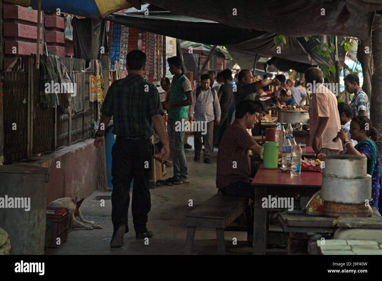 People eating street food on a street in central Kolkata - Calcutta ...