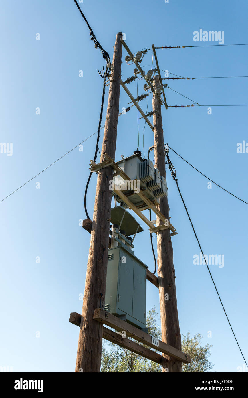Power lines and poles in street Stock Photo - Alamy