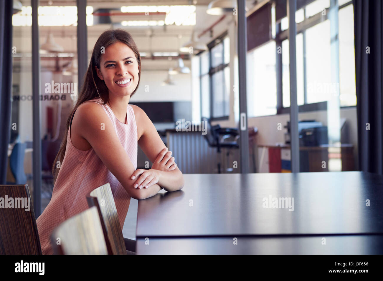 Woman boardroom alone hi-res stock photography and images - Alamy