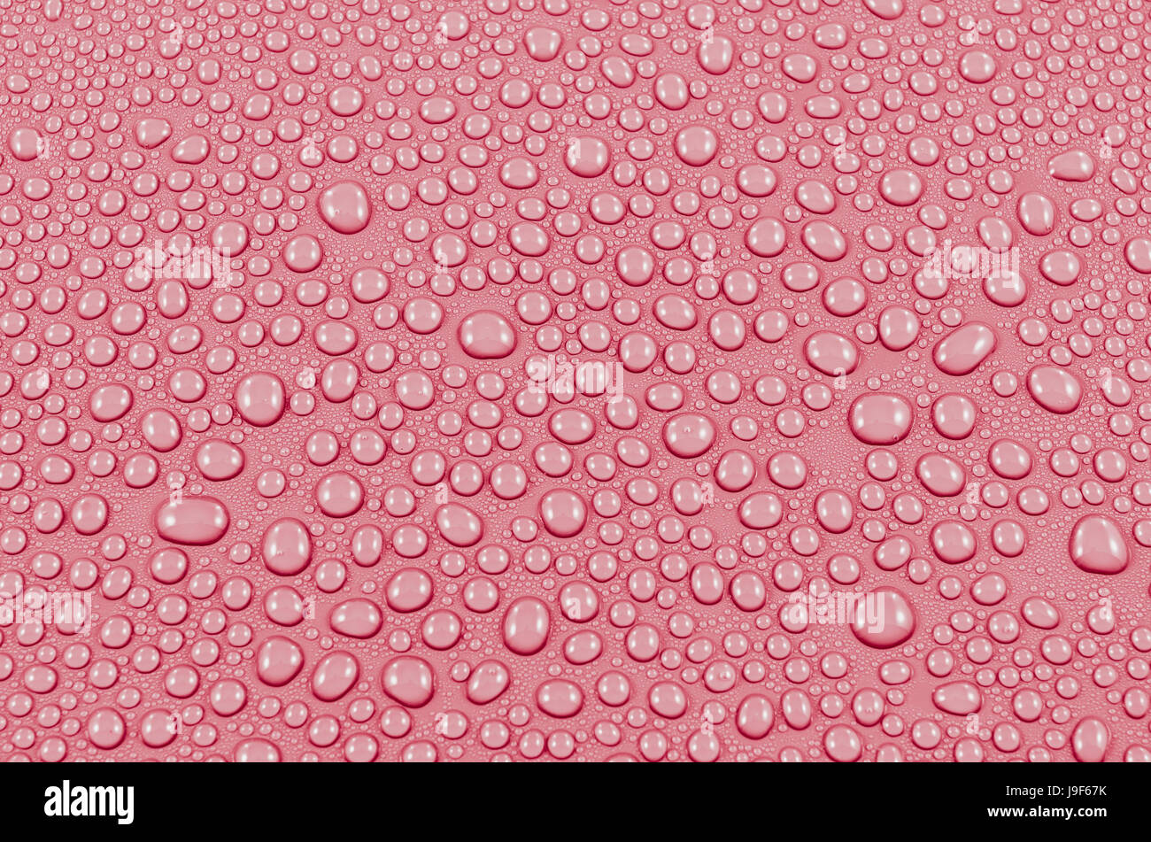 Red water drops background Stock Photo - Alamy