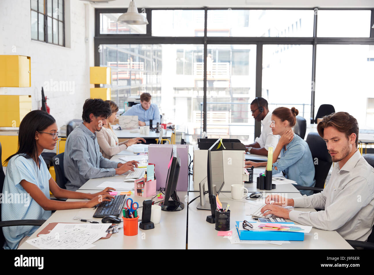 Busy co workers using hi-res stock photography and images - Alamy