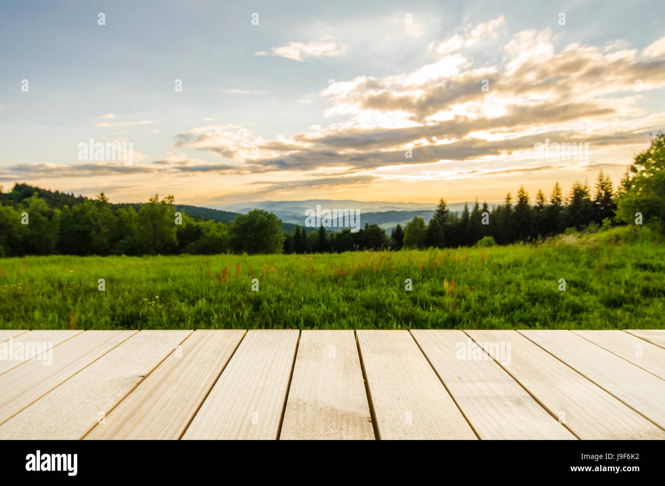 Empty table with landscape background Stock Photo - Alamy