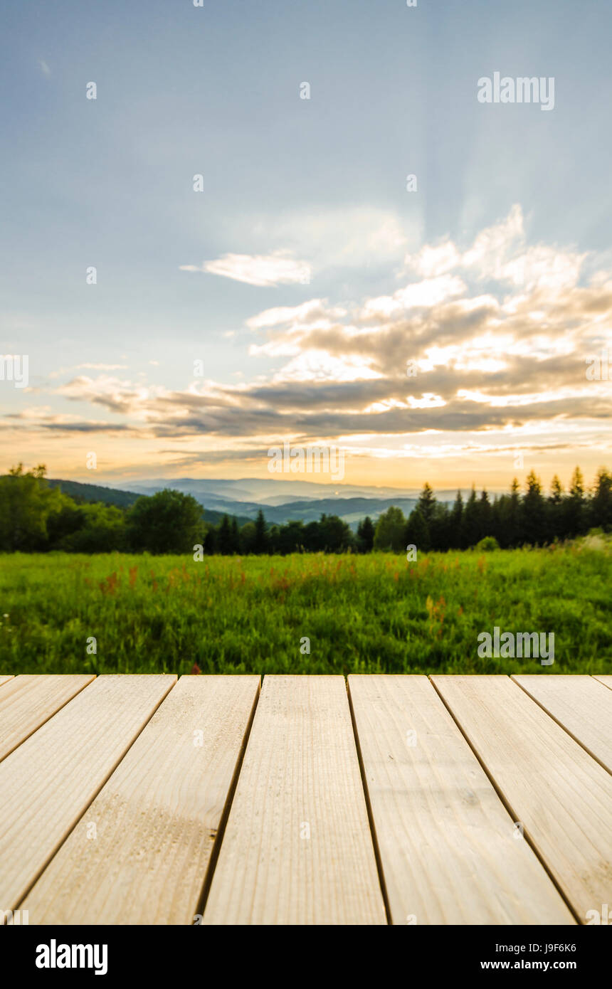 Empty table with landscape background Stock Photo - Alamy