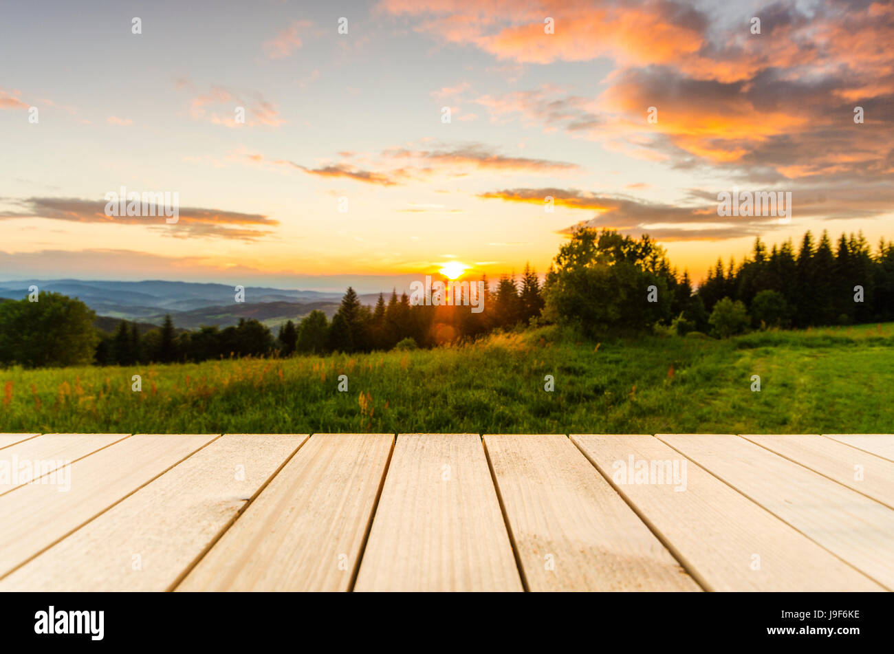 Empty table with landscape background Stock Photo - Alamy