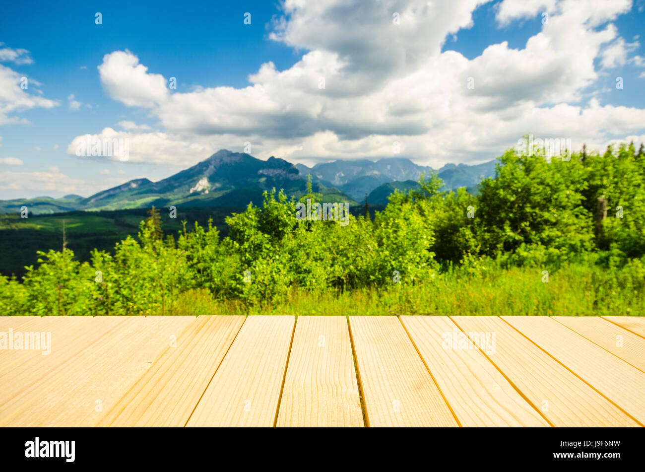 Empty table with landscape background Stock Photo - Alamy