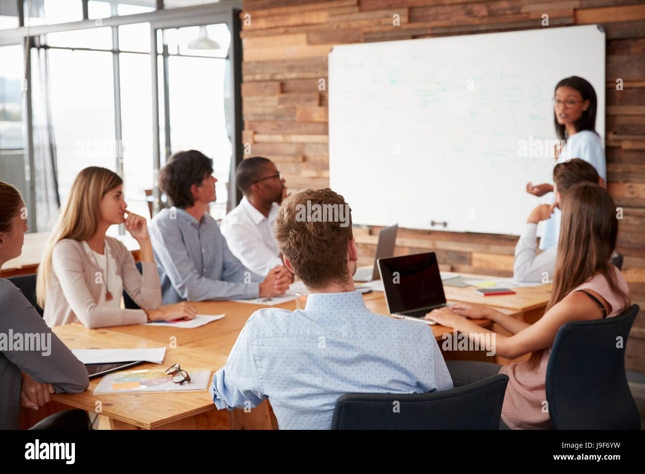 Woman colleagues sitting desks hi-res stock photography and images - Alamy