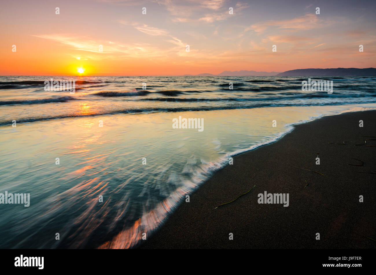 Beautiful sunset at the beach Stock Photo - Alamy