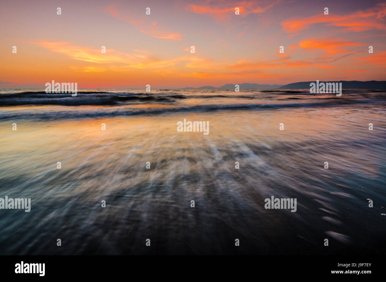 Beautiful sunset at the beach Stock Photo - Alamy