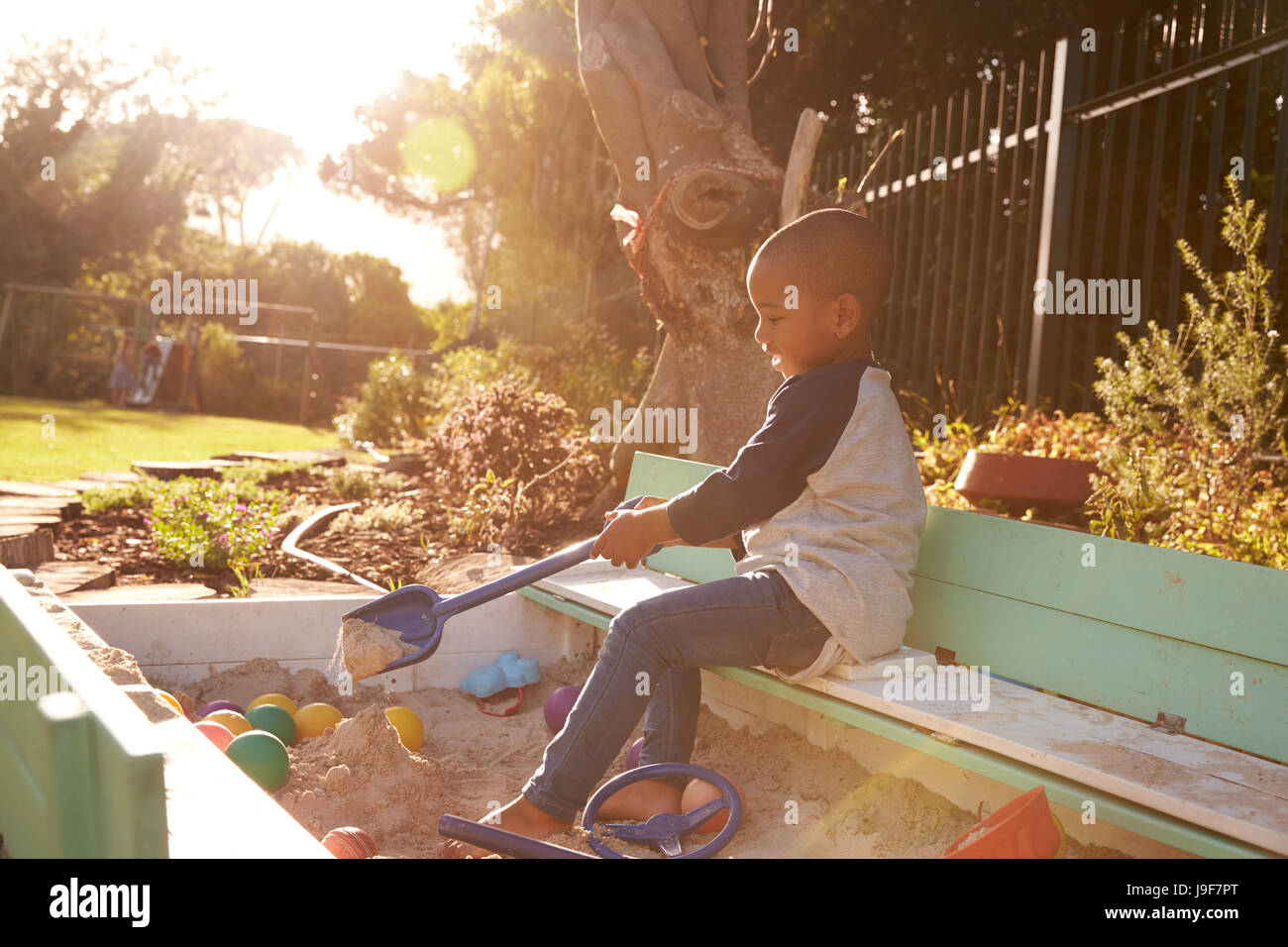 Child digging in the sand with spade hi-res stock photography and ...