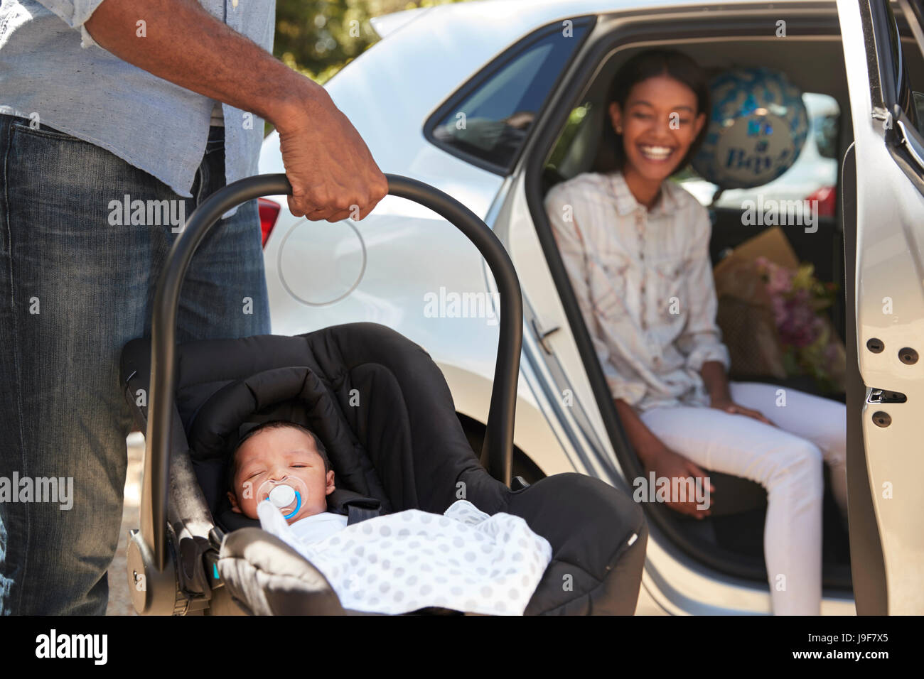 Parents Bringing Newborn Baby Home In Car Stock Photo - Alamy