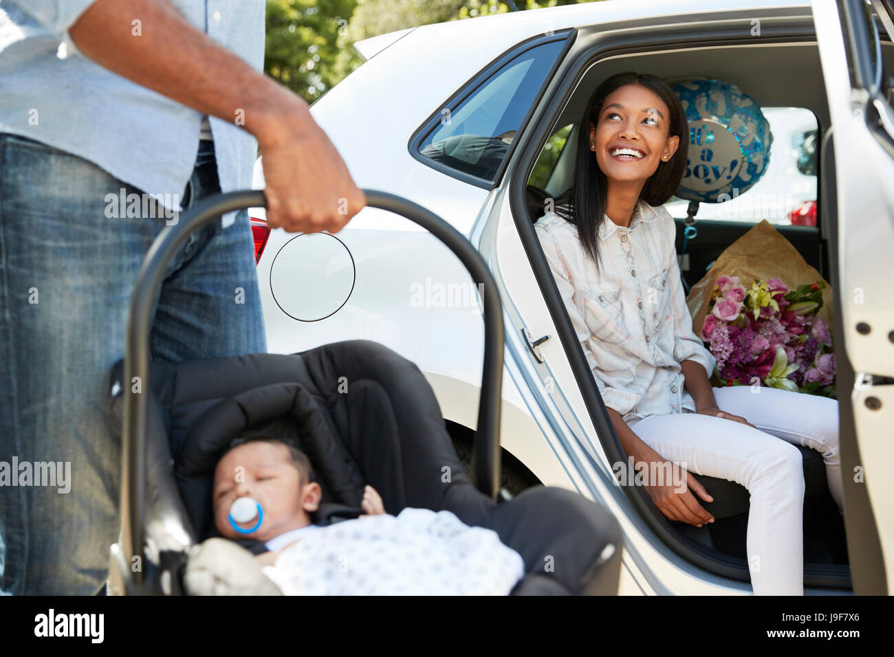 Parents Bringing Newborn Baby Home In Car Stock Photo - Alamy