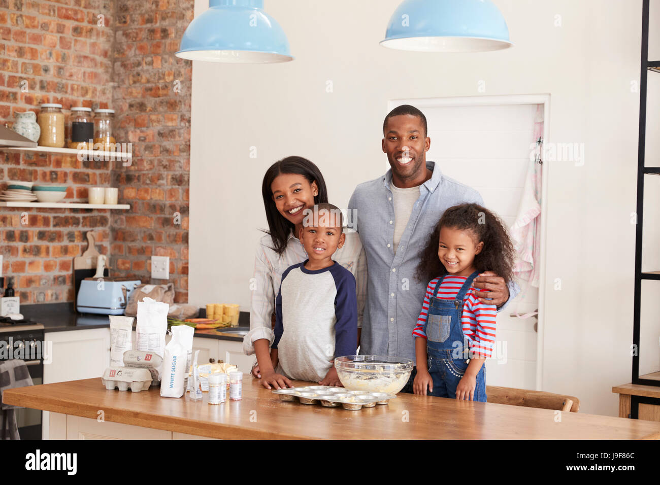 Portrait Of Family Baking Cakes In Kitchen Together Stock Photo - Alamy