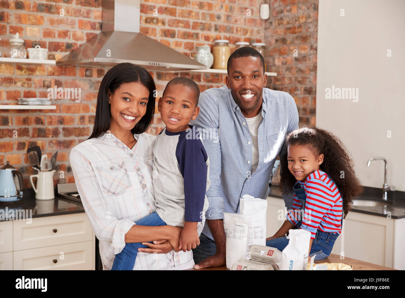 Portrait Of Family Baking Cakes In Kitchen Together Stock Photo - Alamy