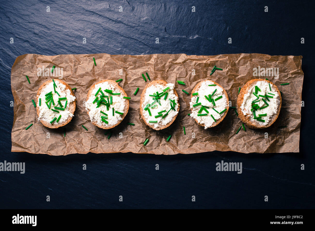 Mini sandwiches on dark background. Top view Stock Photo - Alamy