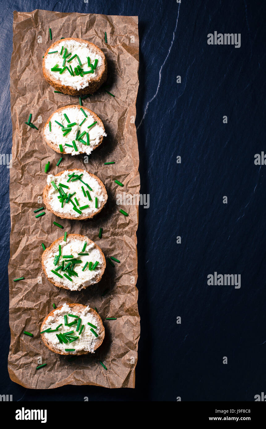 Mini sandwiches on dark background. Top view Stock Photo - Alamy