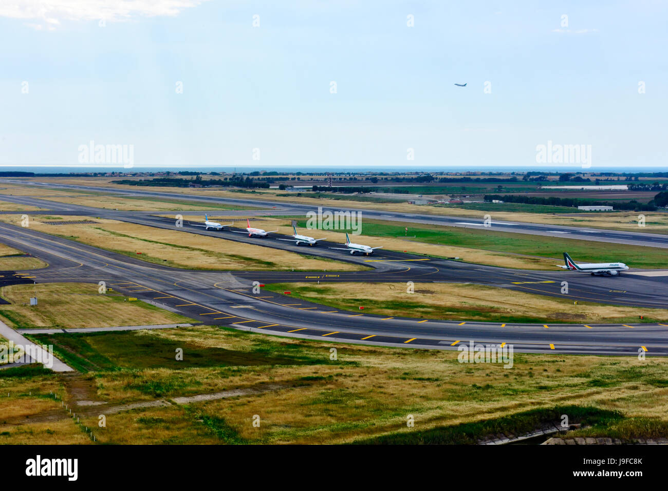 Aerial view of runway with planes at Rome Leonardo da Vinci–Fiumicino ...