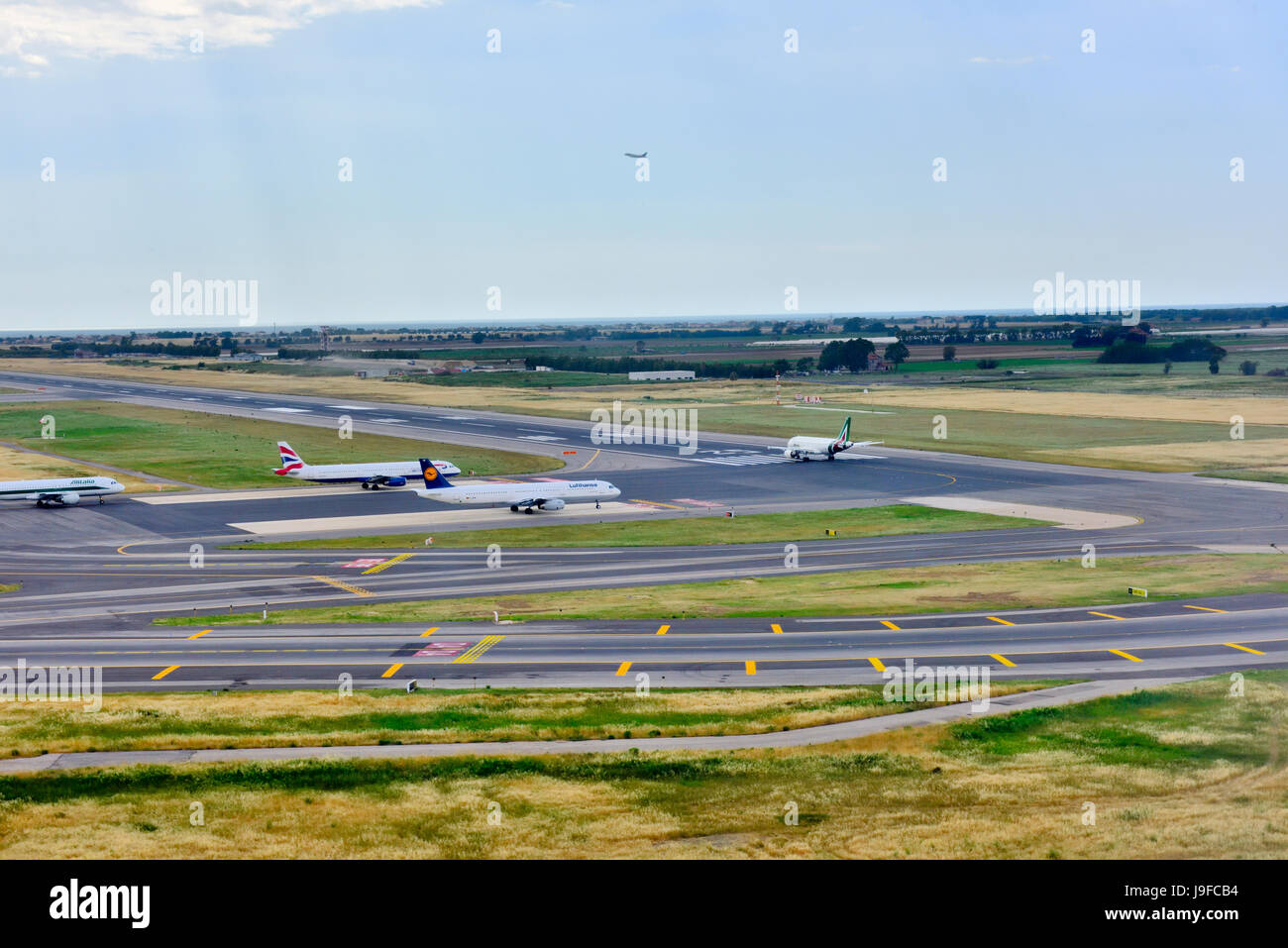 Aerial view of runway with planes at Rome Leonardo da Vinci–Fiumicino ...