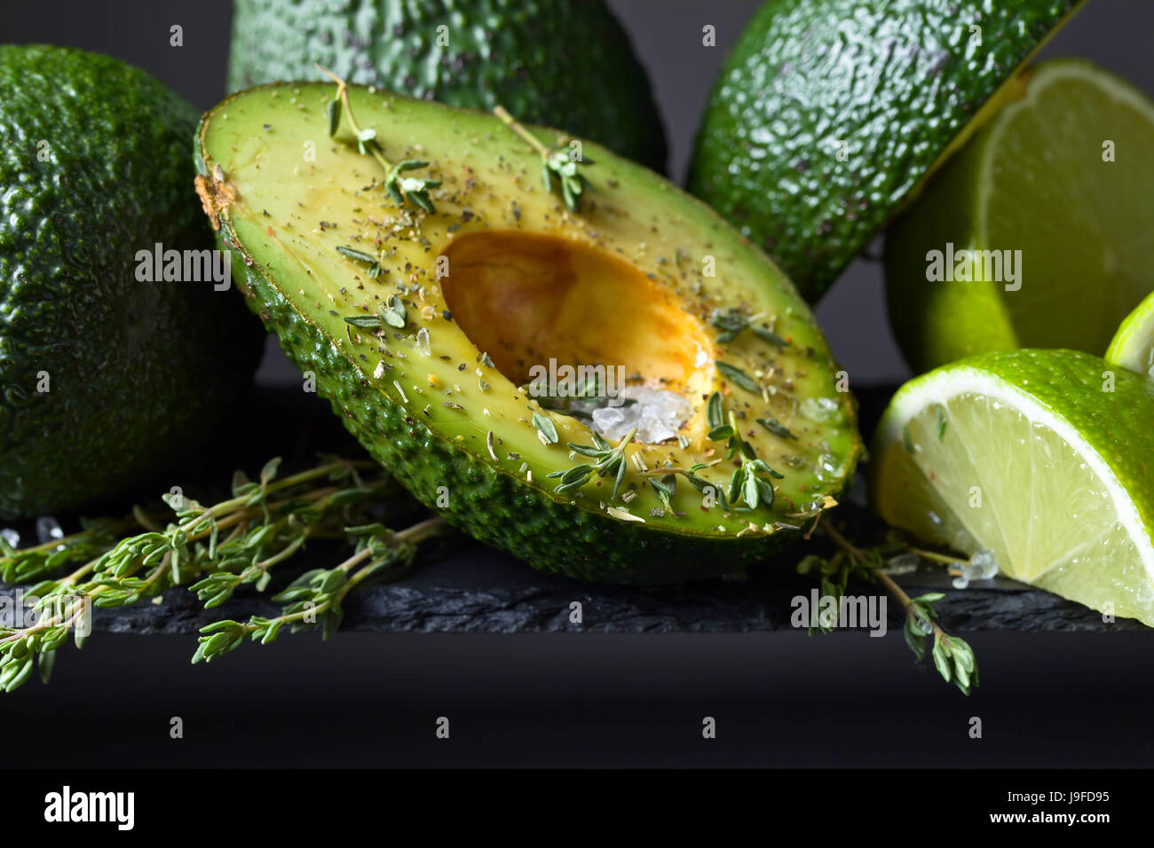 Avocado with lime , thyme and sea salt .Healthy vegetarian food Stock ...