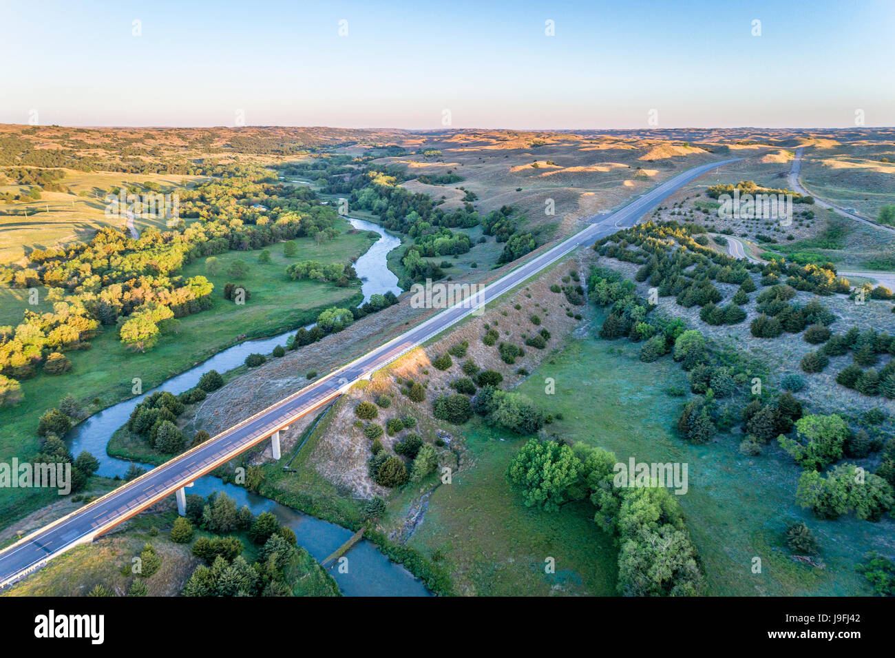 aerial view of a highway and bridge over the Dismal River in Nebraska ...