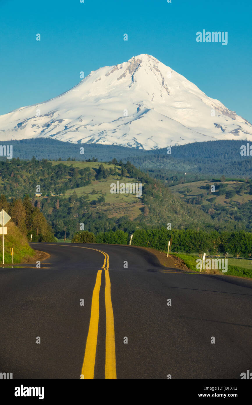 Eastern side of Mount Hood rising above a highway in Oregon Stock Photo ...