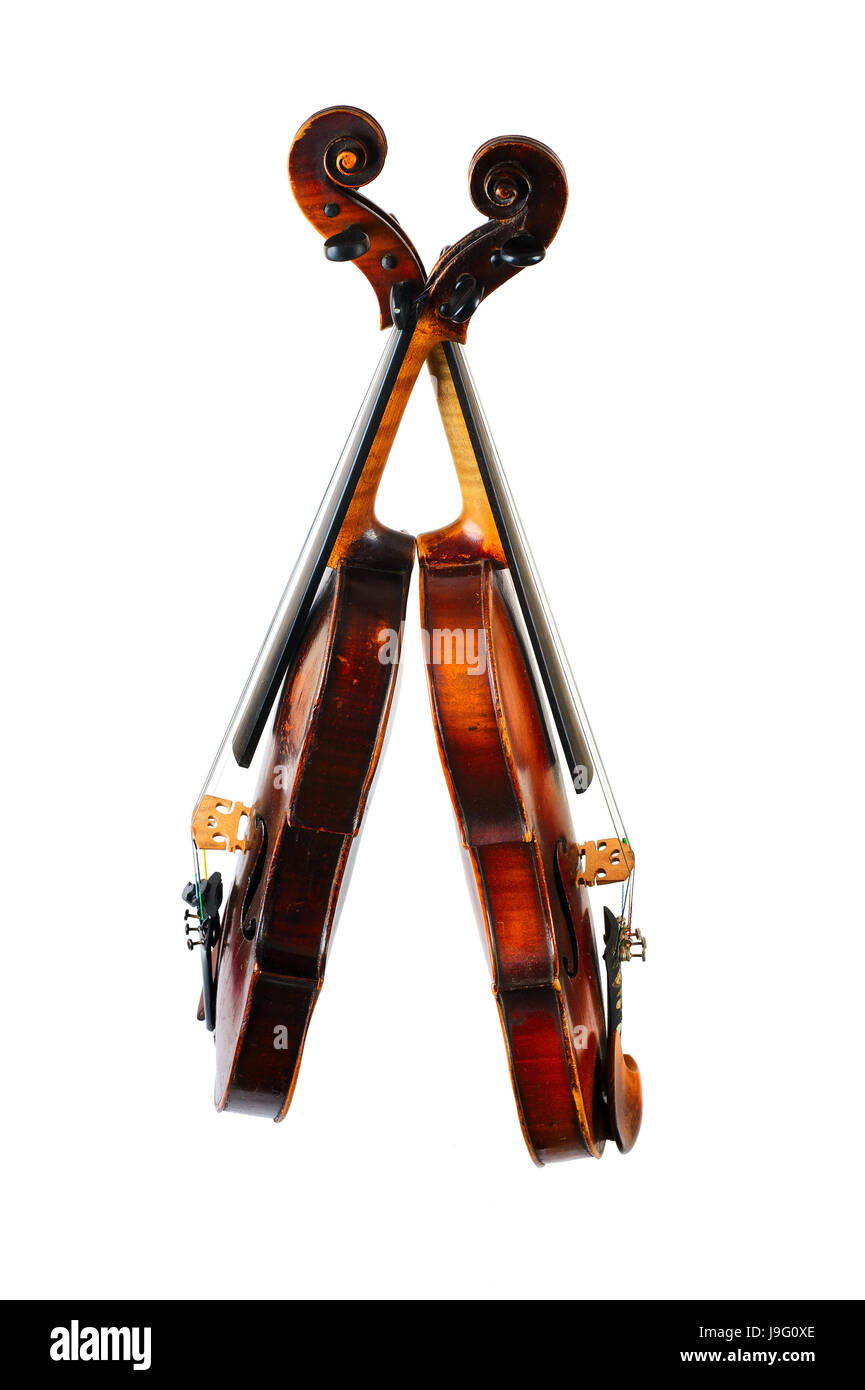 two violin image .old brown stringed wooden instrument isolated on the ...
