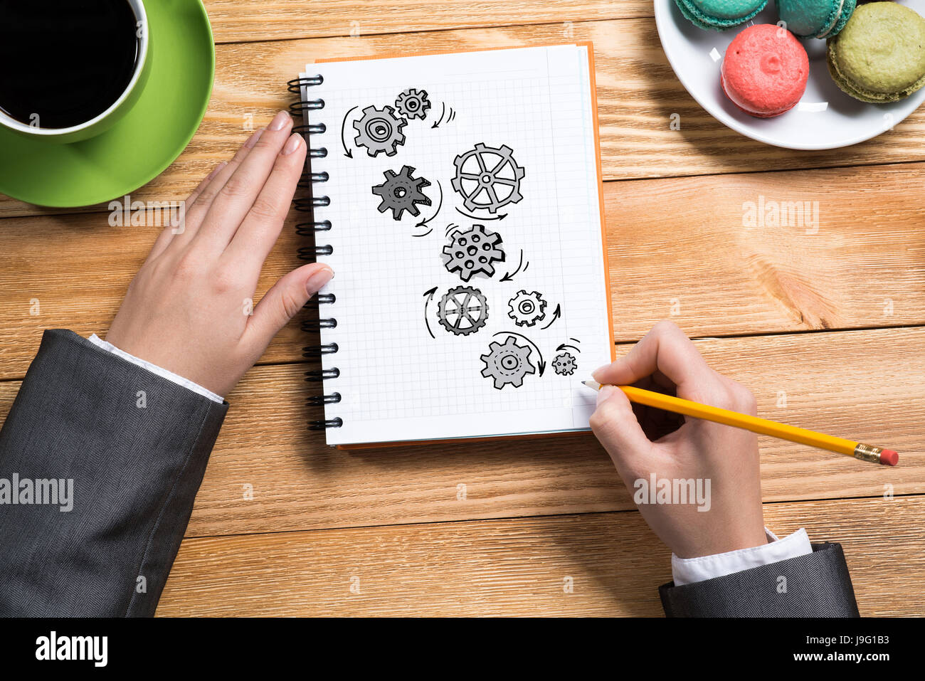 Businesswoman sketching in notepad Stock Photo - Alamy