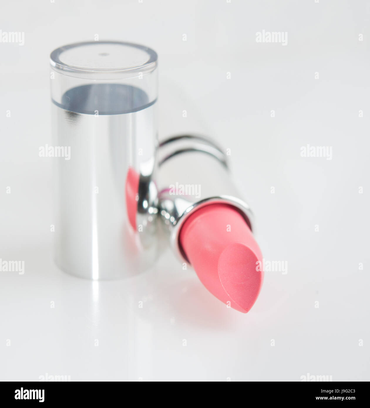 Pink lipstick in a silver tube Stock Photo - Alamy