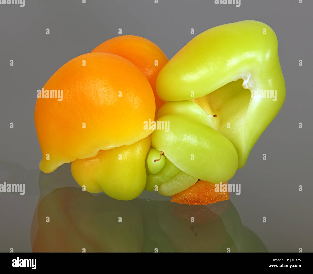 The insides of peppers on a mirror table Stock Photo - Alamy