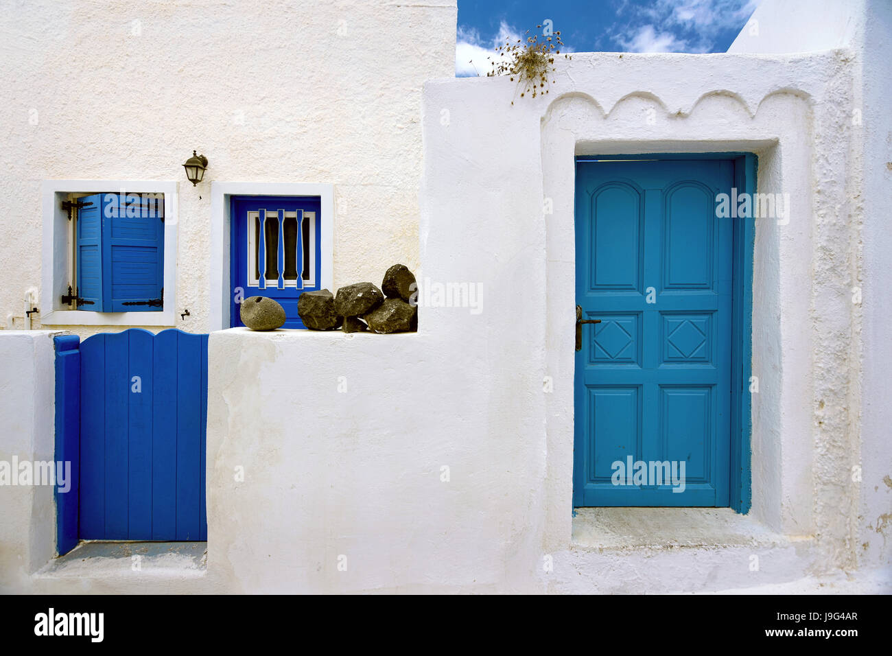 Typical blue doors and white walls in the island of Santorini, Greece ...