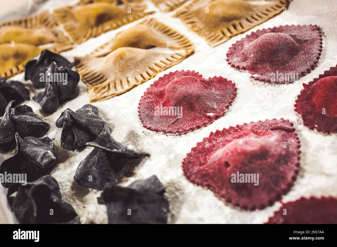 different kinds and colors of homemade fresh stuffed pasta Stock Photo ...