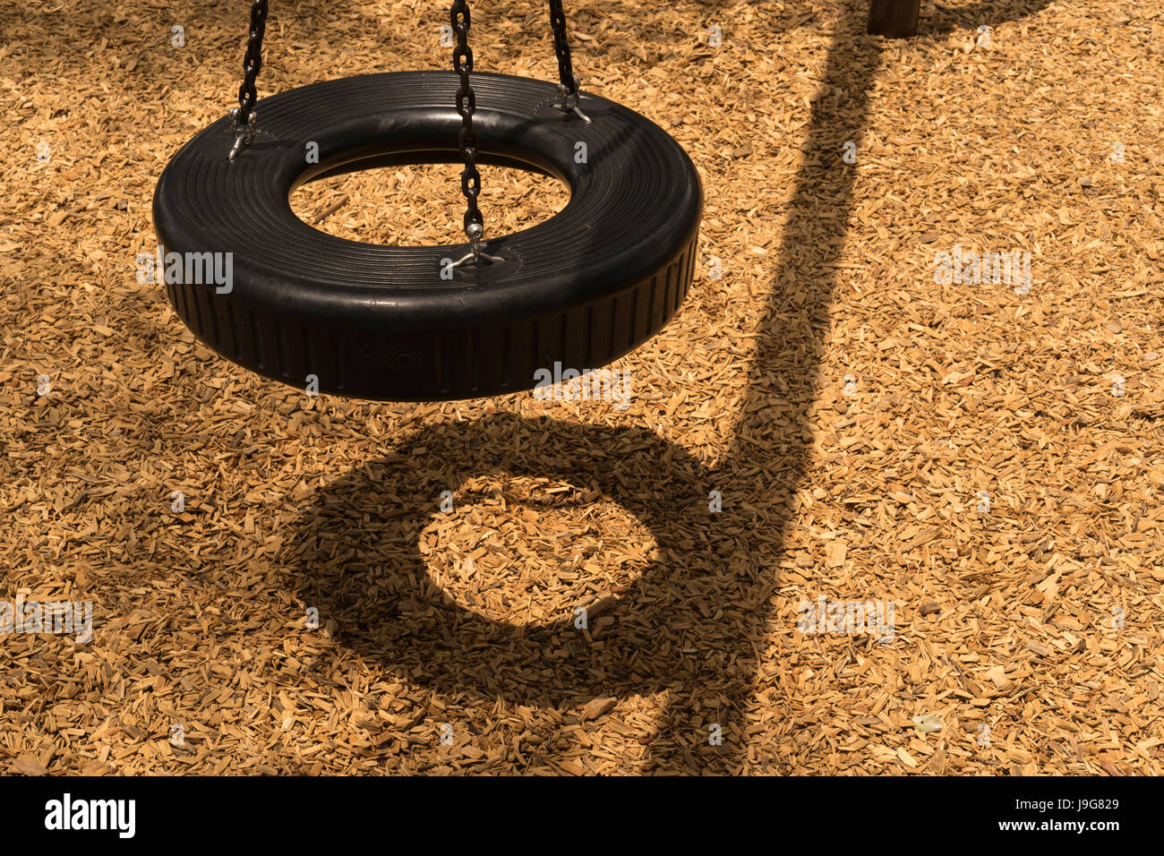 Black Tire Swing At A School Playground Stock Photo - Alamy