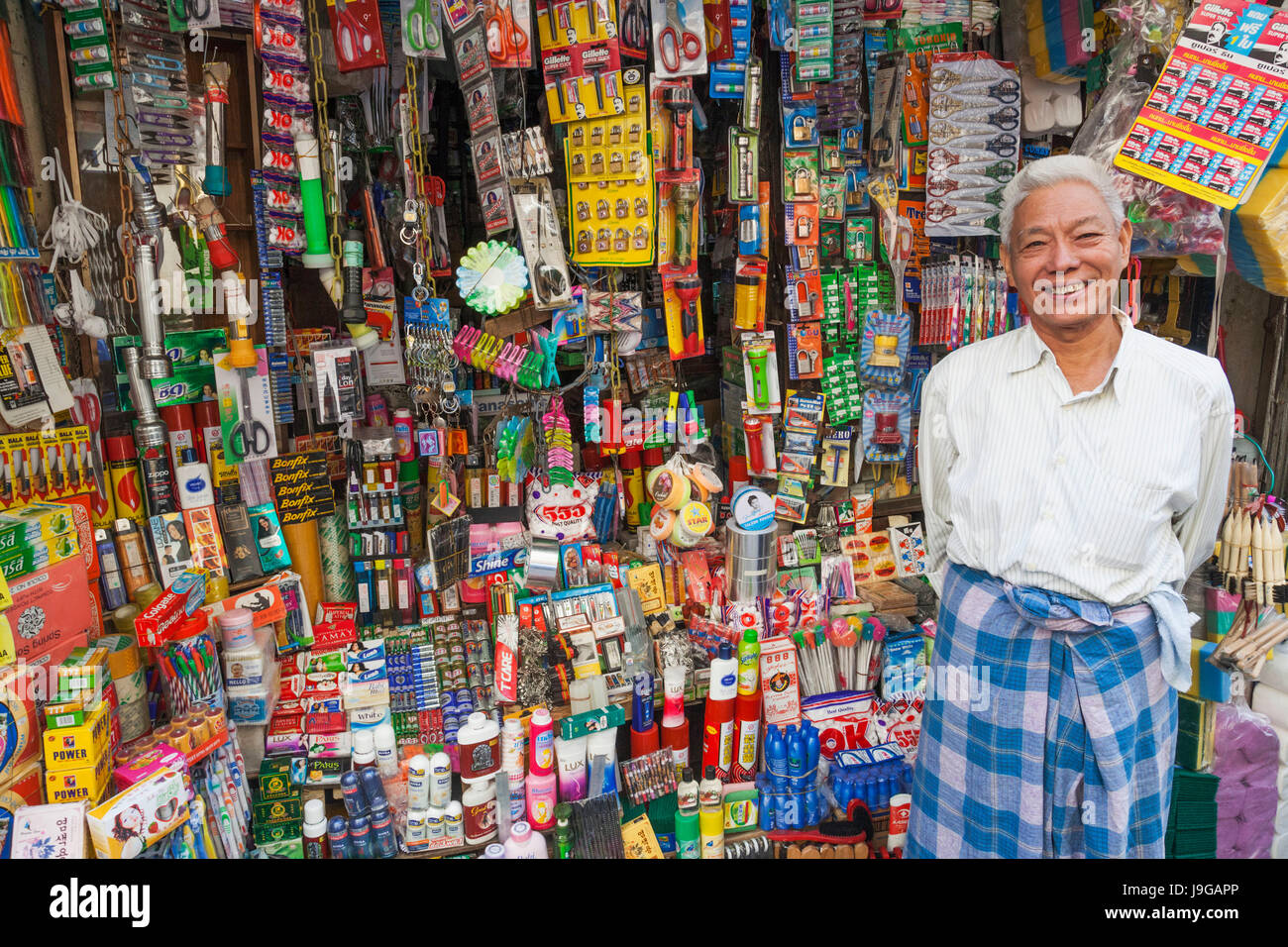 Myanmar, Yangon, Street Market, General Store Owner and Display Stock ...