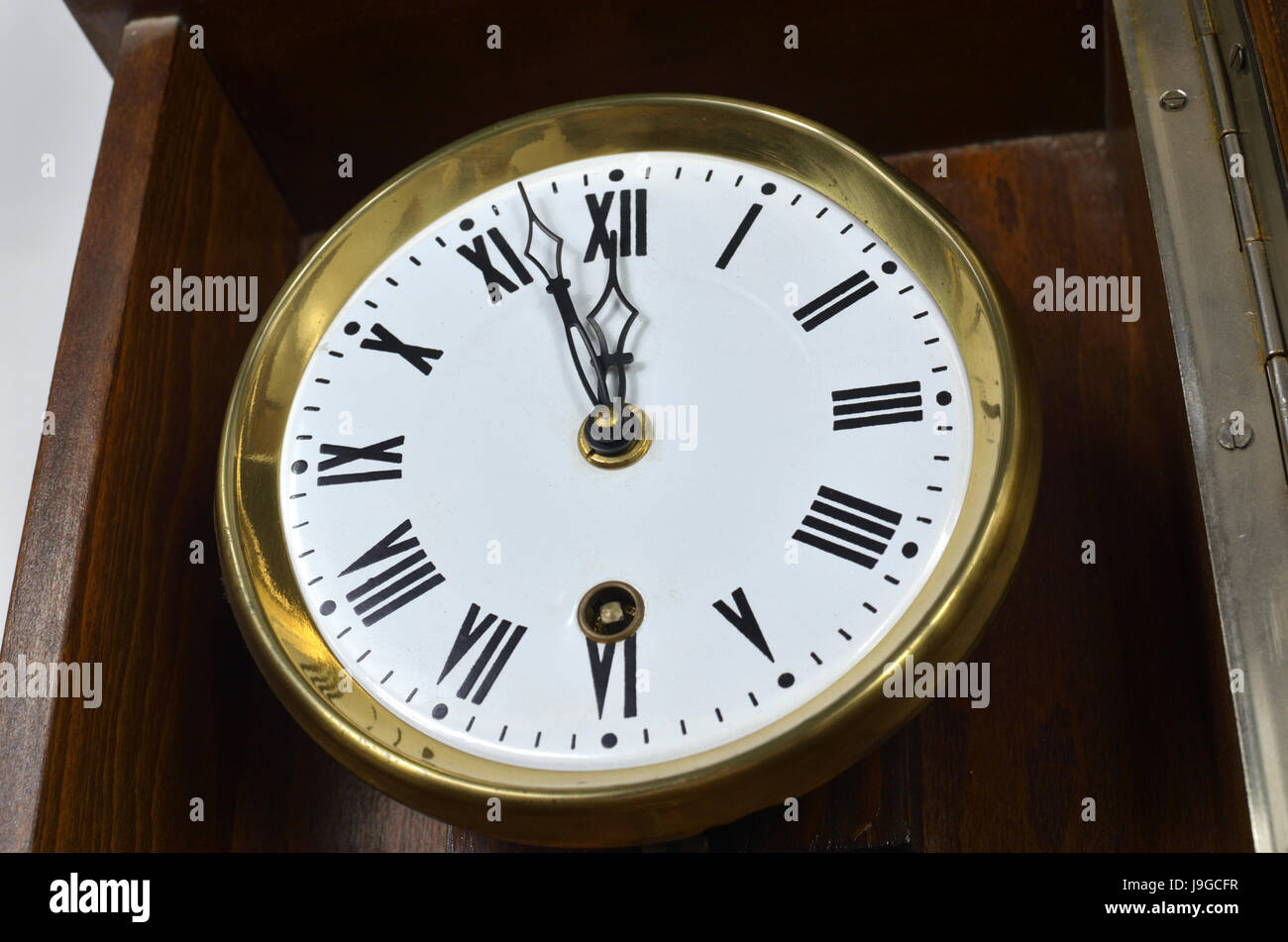 Clock in vintage style showing midnight or noon Stock Photo - Alamy