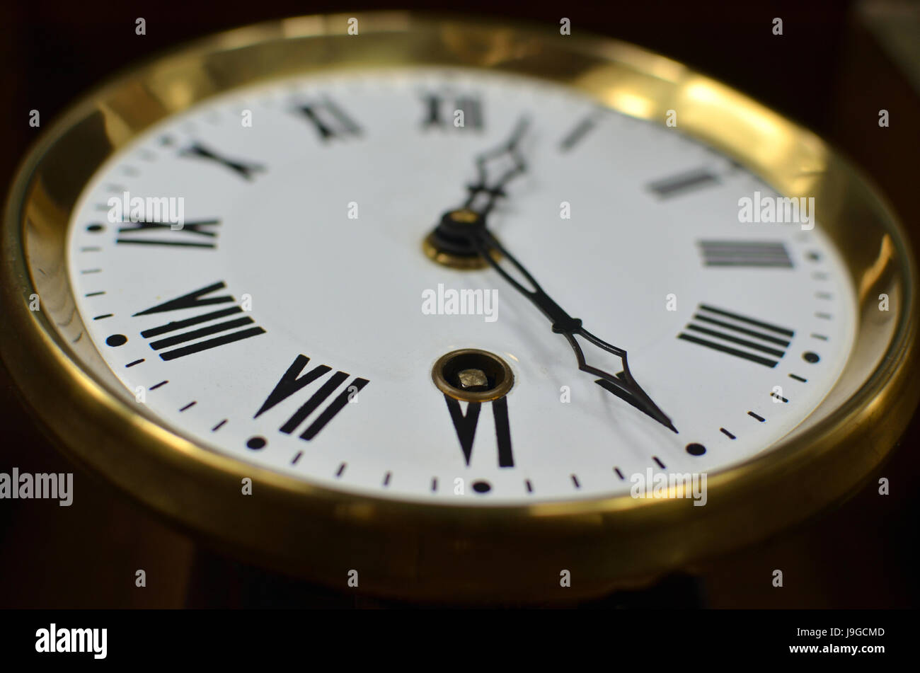 Close-up of a hand of a vintage clock Stock Photo - Alamy
