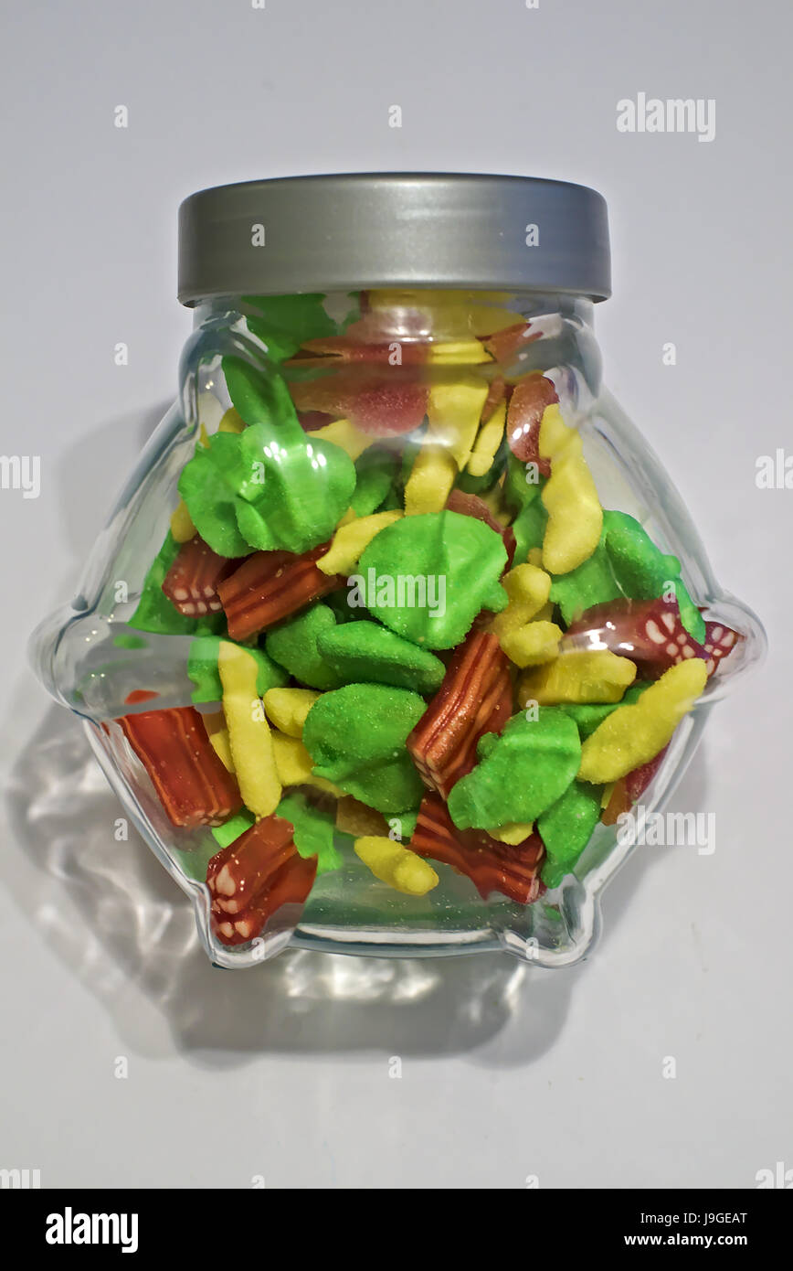 Glass jar containing delicious fruit shaped gummies Stock Photo - Alamy