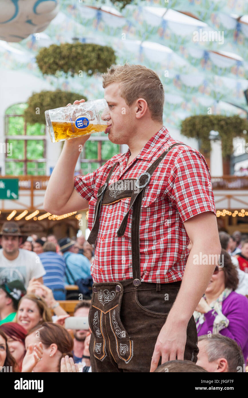 Germany, Bavaria, Munich, Oktoberfest, Man Drinking Beer Stock Photo ...