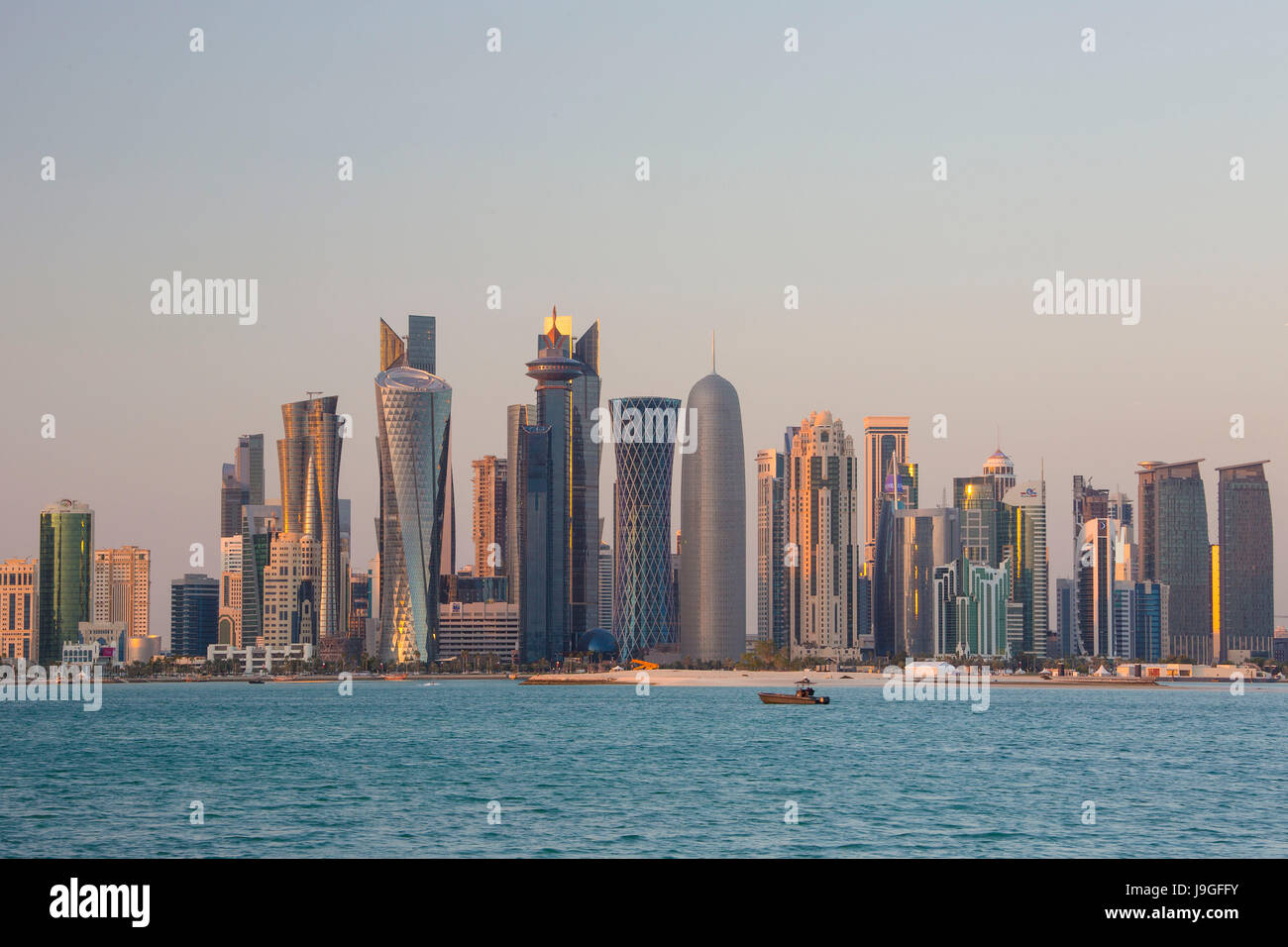 Qatar, Doha City, The Corniche, West Bay Skyline at sunset Stock Photo ...