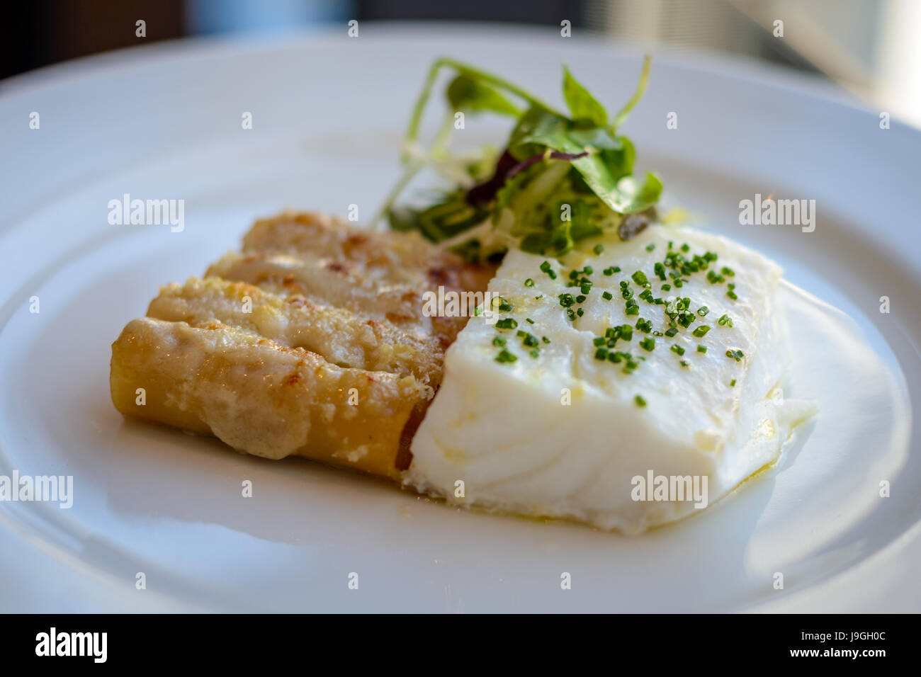 Silver cod, lobster macaroni and piquillo sauce Stock Photo - Alamy
