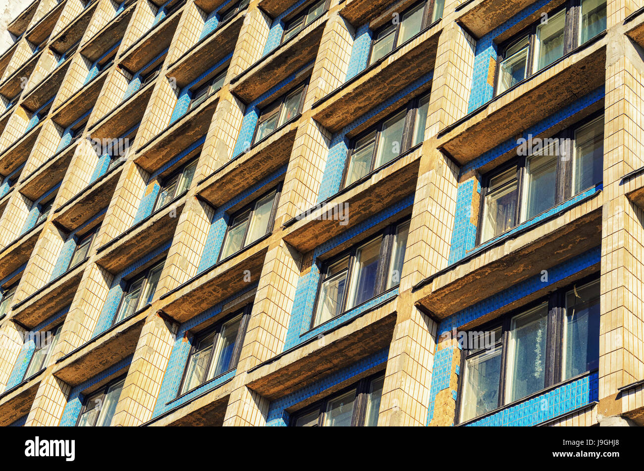Residential cells of the hostel building. Facade of the building with ...
