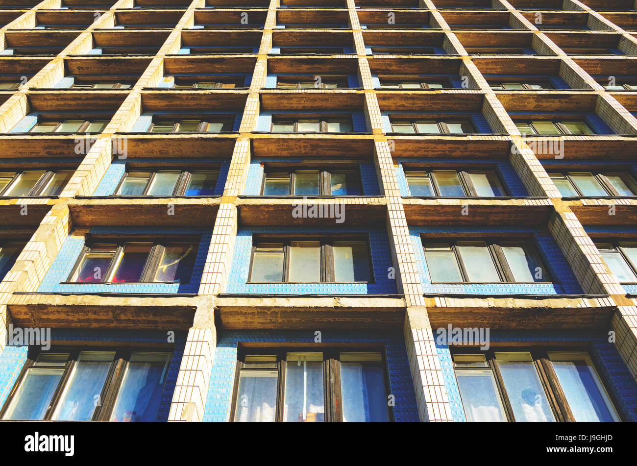 Residential cells of the hostel building. Facade of the building with ...