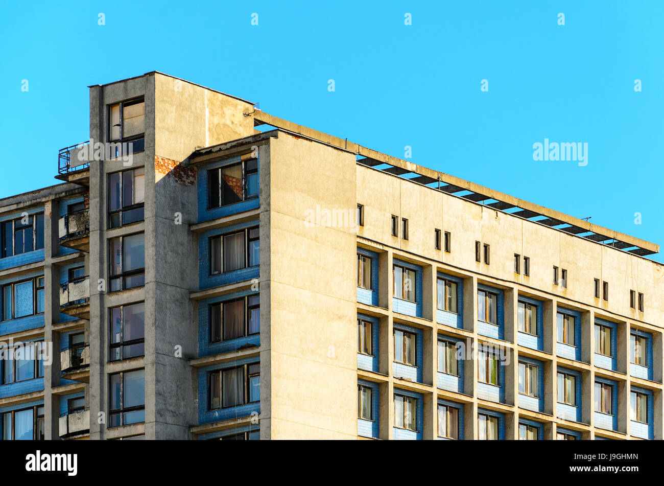 Top part of facade moden building. Detail of hostel building against ...
