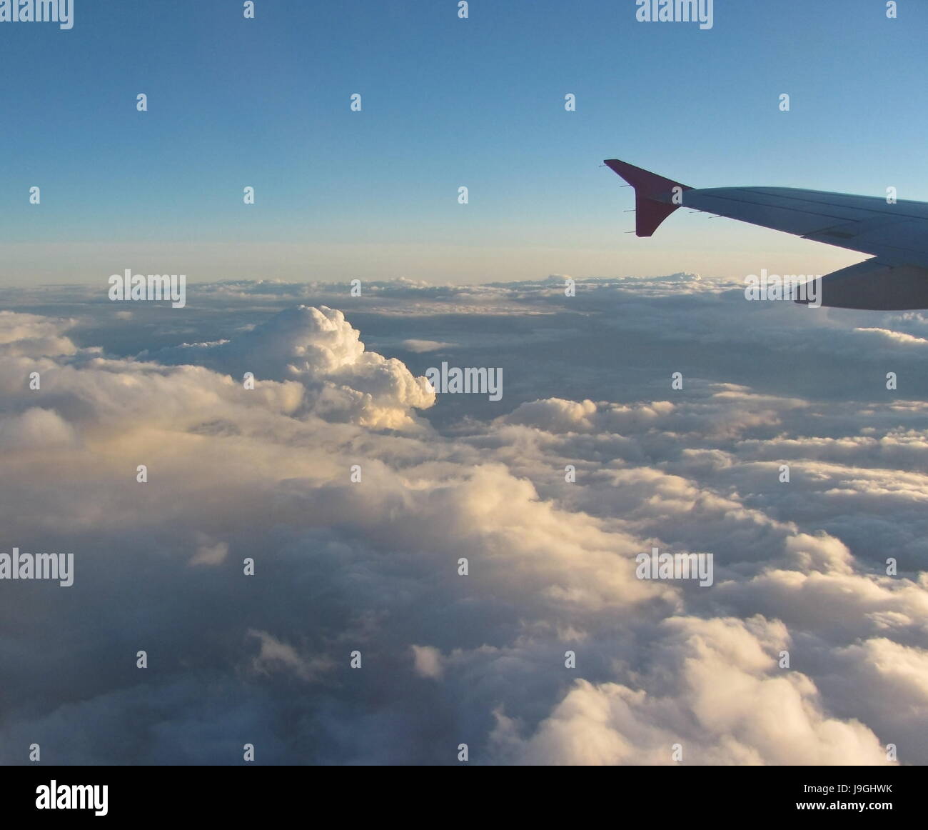 View from the airplane window. Sky with clouds, wing of an airplane ...
