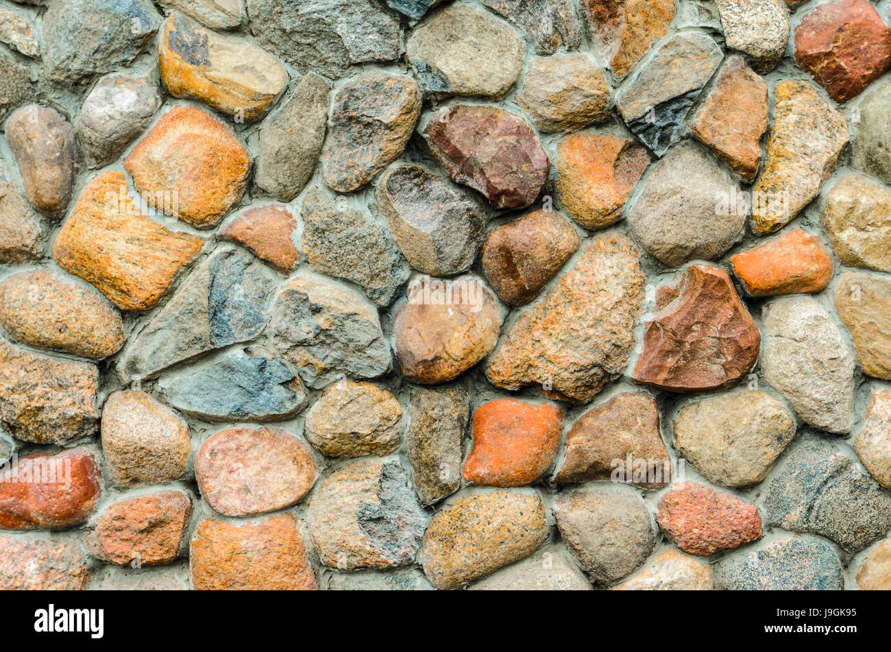 Rubble masonry wall. Stone wall made of various sizes stone, can be ...